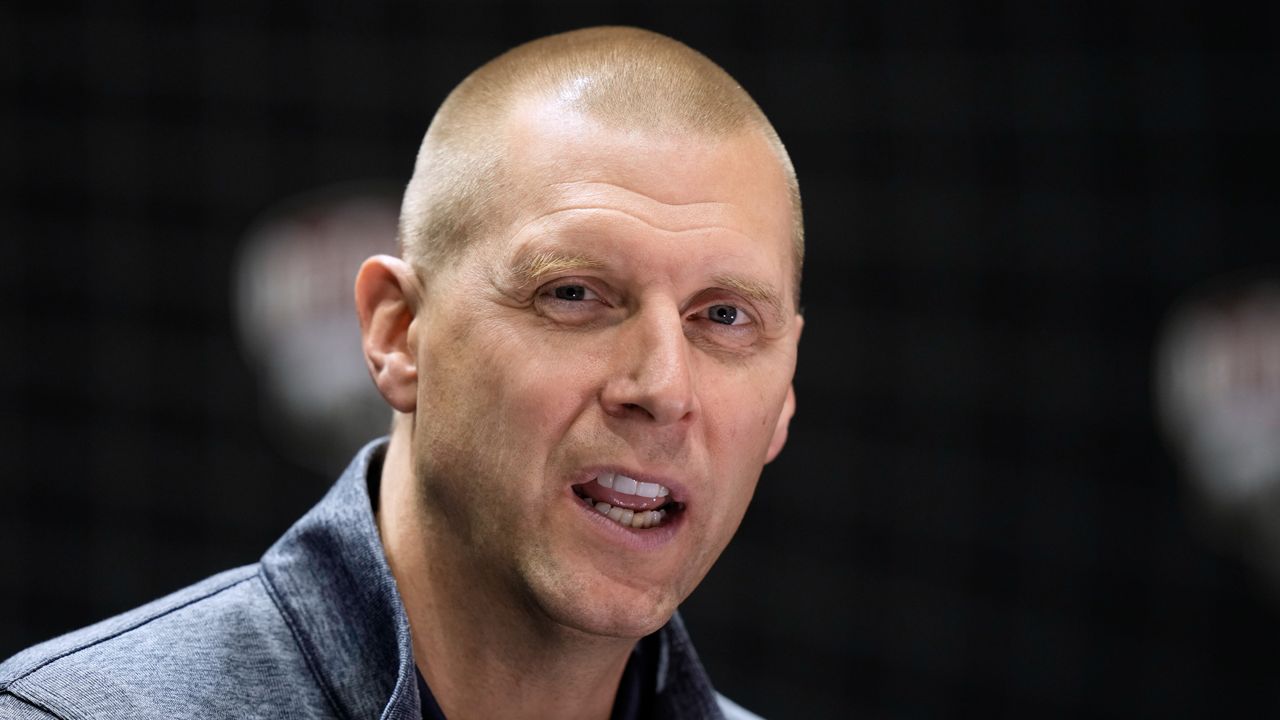 Mark Pope files for divorce with his wife Lee Anne when he...