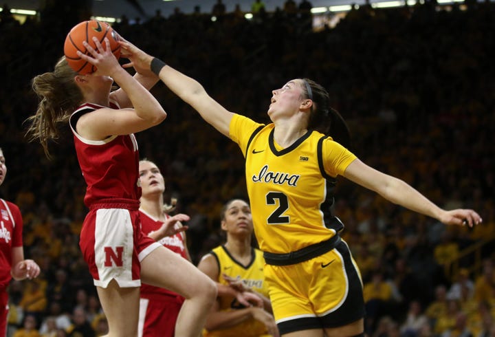 Iowa guard Chit-Chat Wright (No. 11) advances the ball