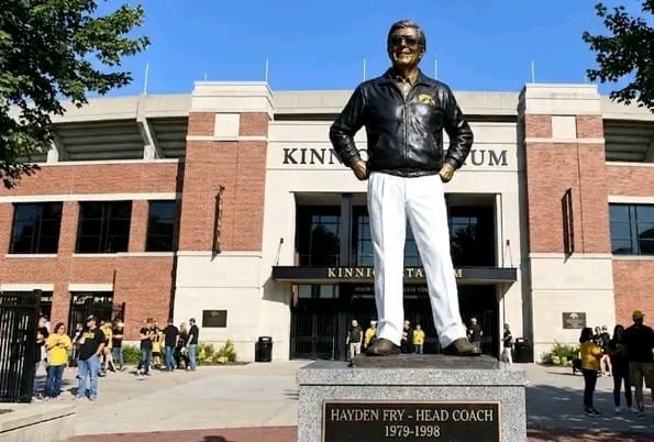 Outside Kinnick Stadium, two towering bronze figures